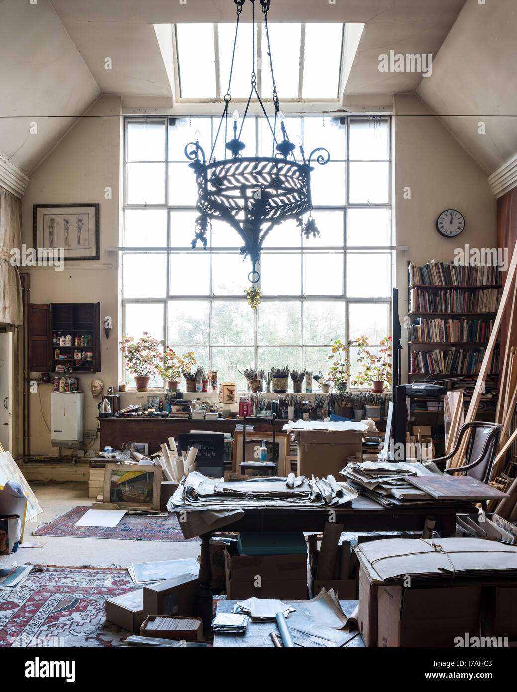 Huge window and skylight in large bohemian studio space with wrought ...