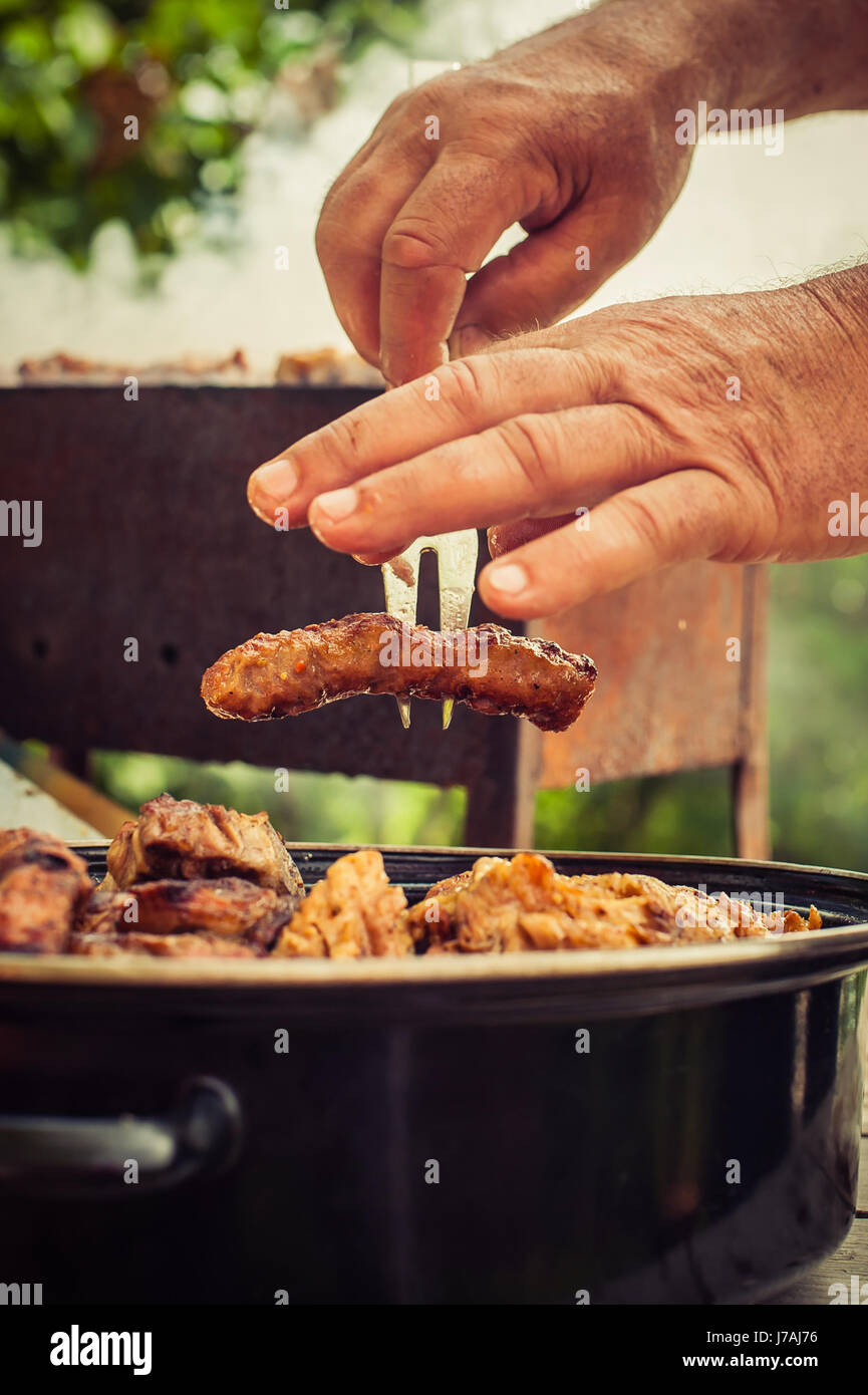 BBQ. Closeup of homemade barbecue grilling picnic in backyard outdoor ...