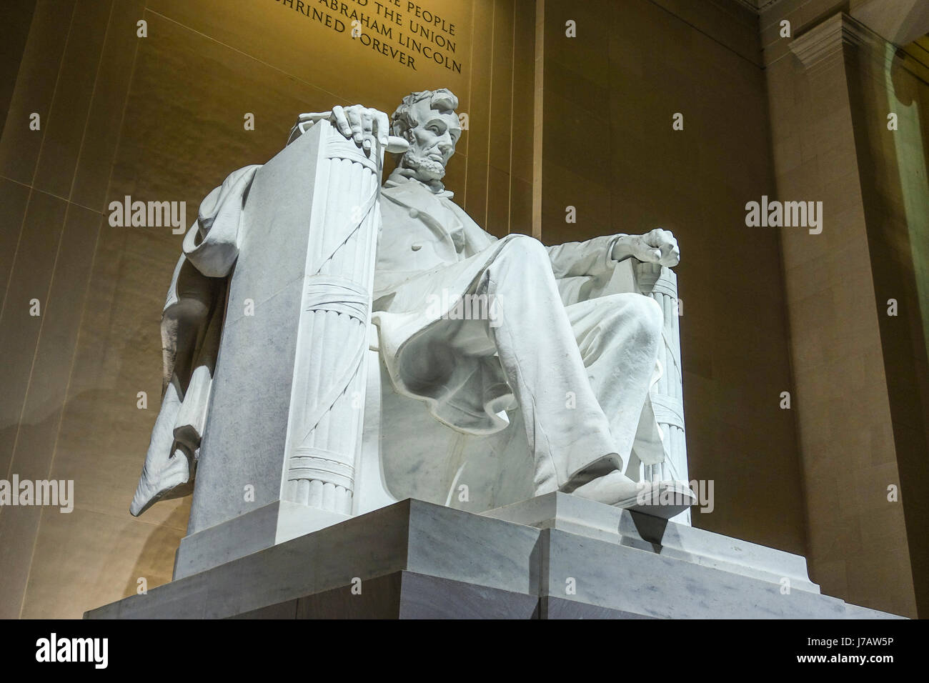 The statue of Abraham Lincoln sitting in a chair at Lincoln Memorial in ...
