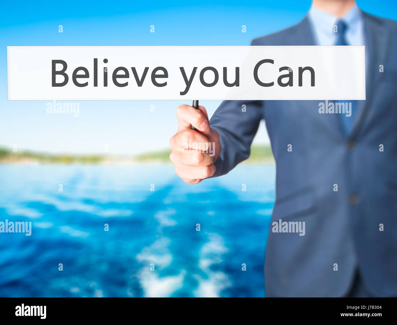 Believe you Can - Businessman hand holding sign. Business, technology ...