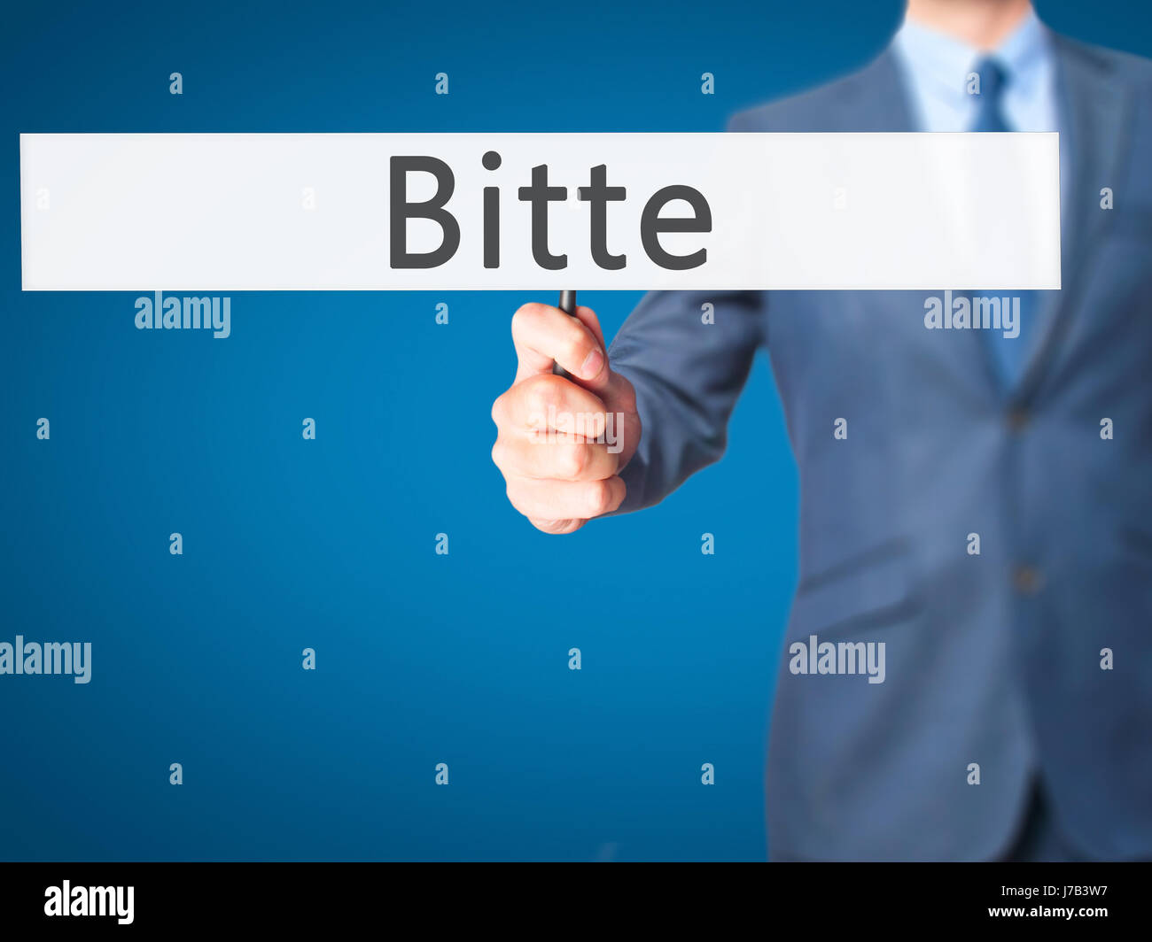 Bitte (Please in German) - Businessman hand holding sign. Business ...