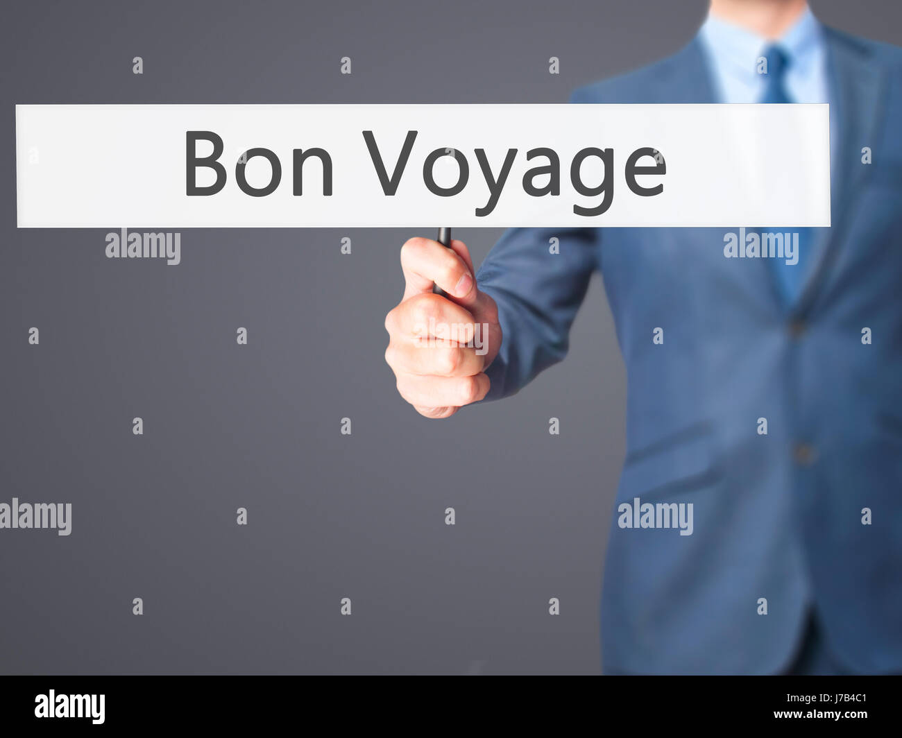 Bon Voyage (Have a Good Trip In French) - Businessman hand holding sign ...