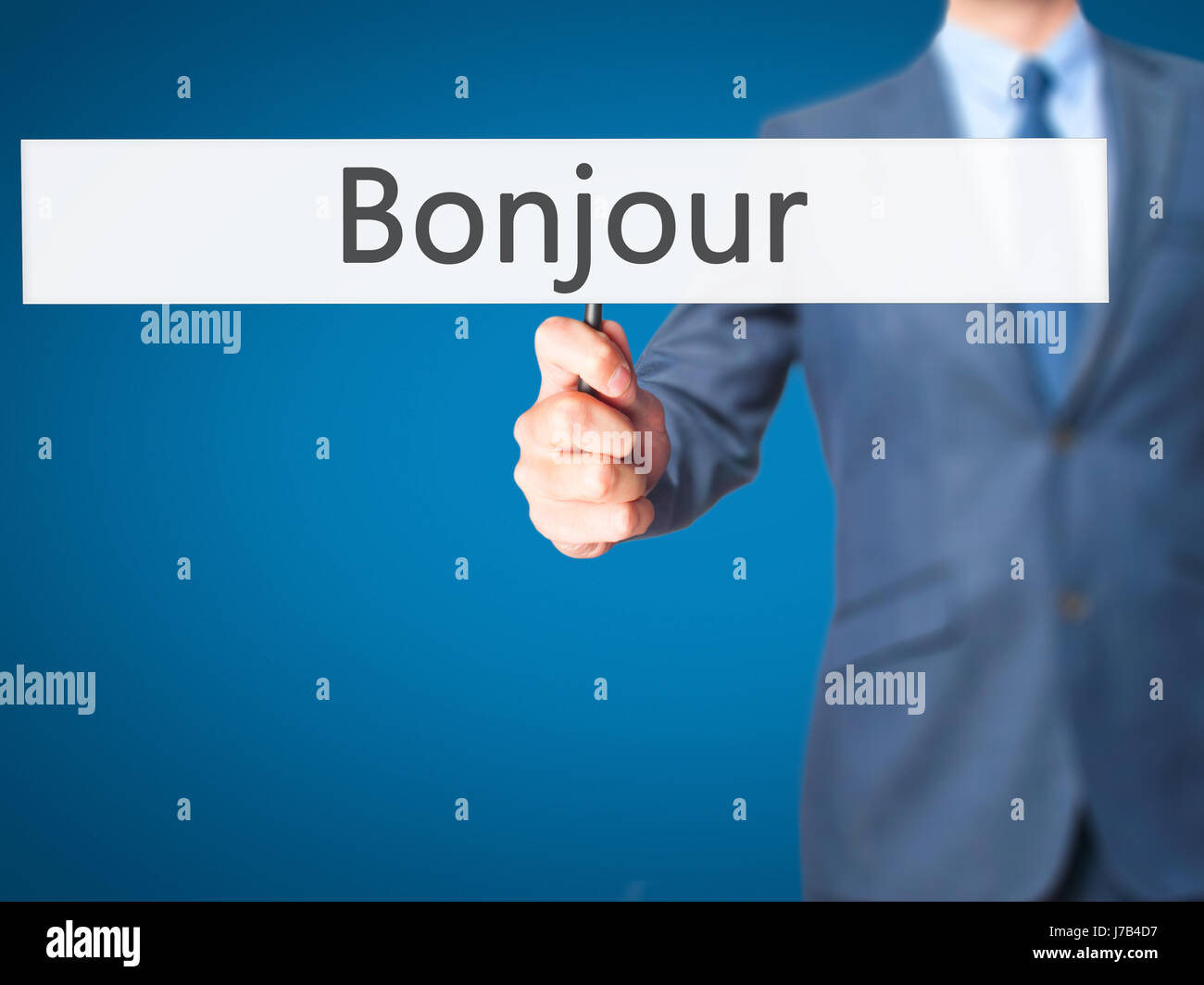 Bonjour (Good Morning in French) - Businessman hand holding sign ...