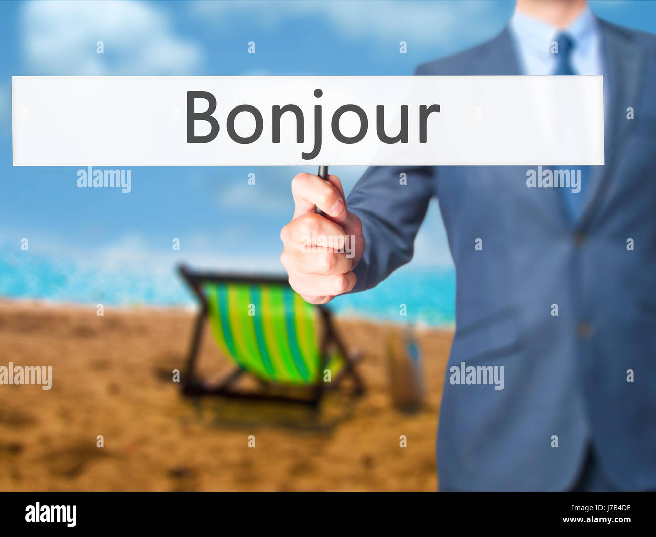 Bonjour (Good Morning in French) - Businessman hand holding sign ...