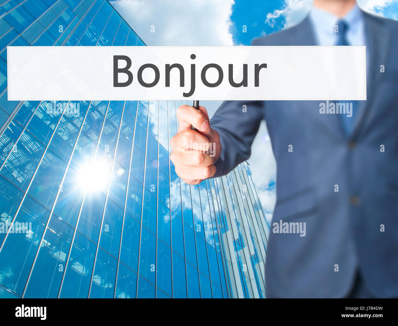 Bonjour (Good Morning in French) - Businessman hand holding sign ...