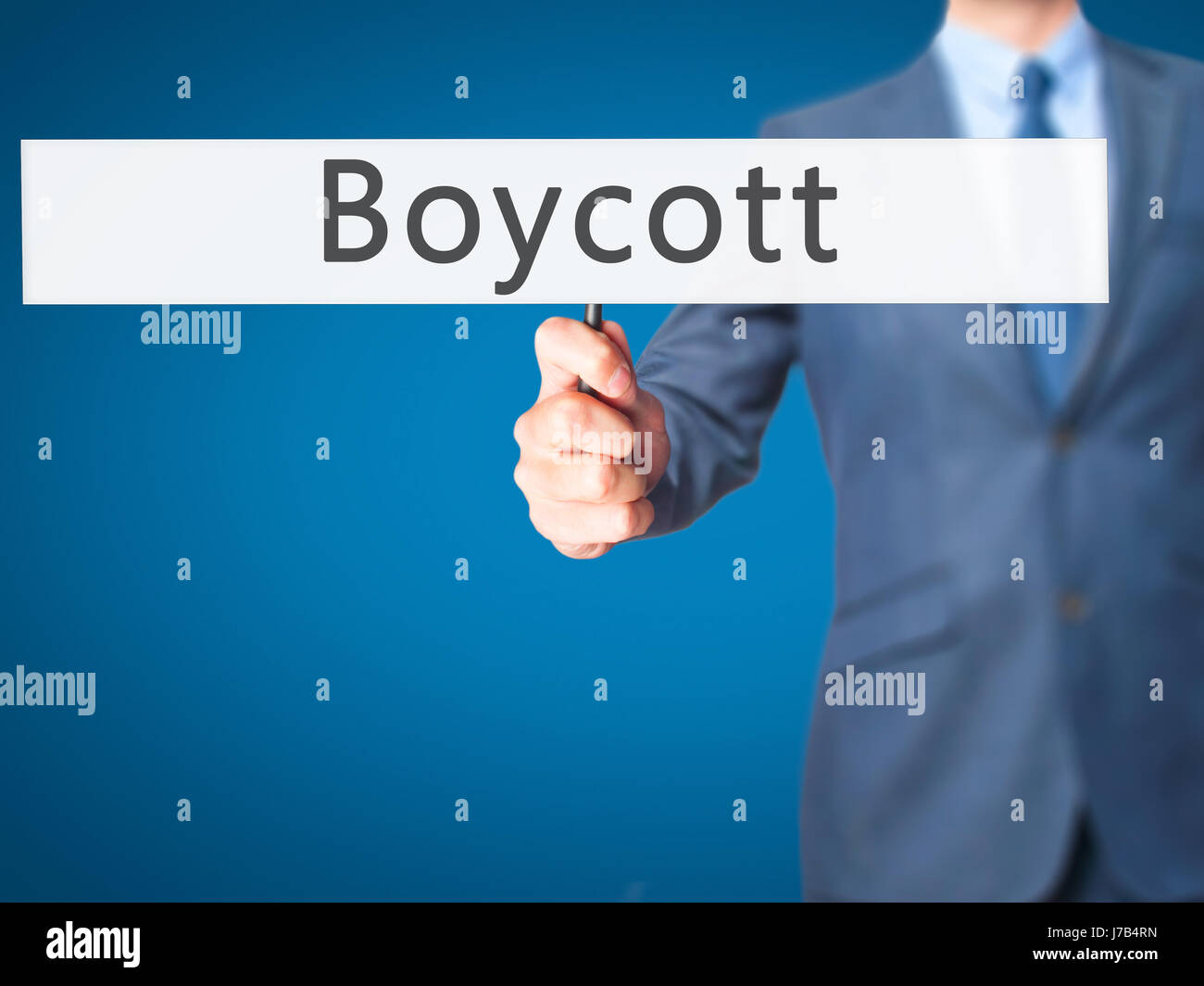 Boycott - Businessman hand holding sign. Business, technology, internet ...