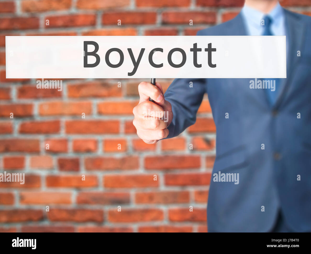 Boycott - Businessman hand holding sign. Business, technology, internet ...