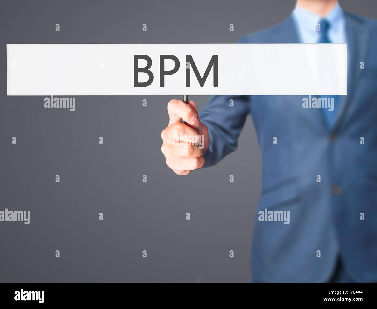BPM (Business Process Management) - Businessman hand holding sign ...