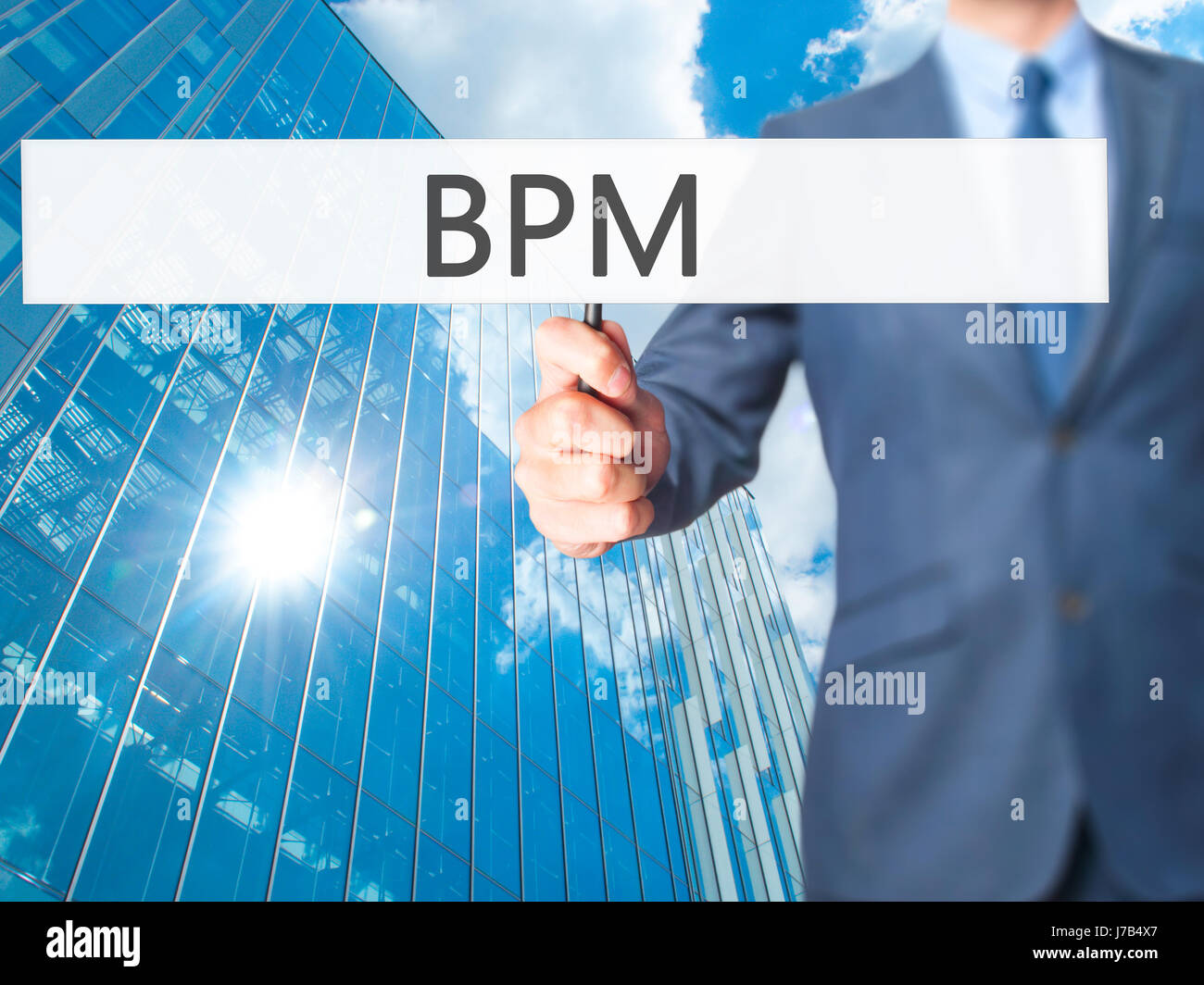 BPM (Business Process Management) - Businessman hand holding sign ...