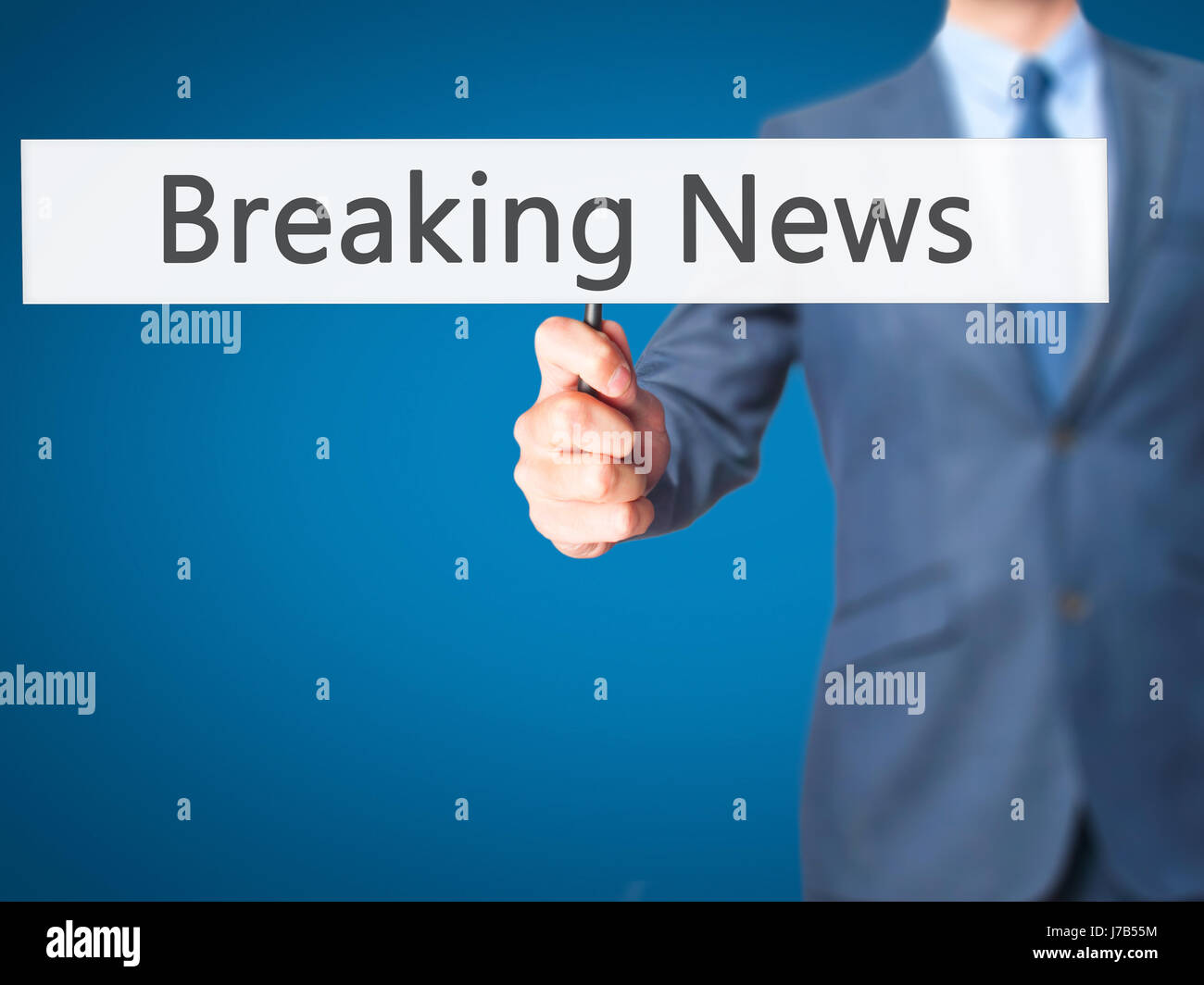Breaking News - Businessman hand holding sign. Business, technology ...
