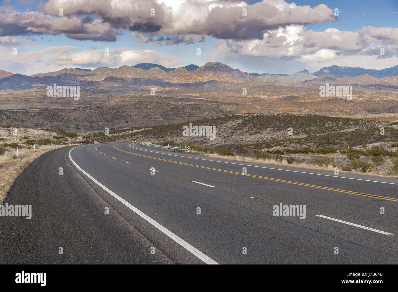 Curved Highway With Distant Mountains, Arizona USA Stock Photo - Alamy