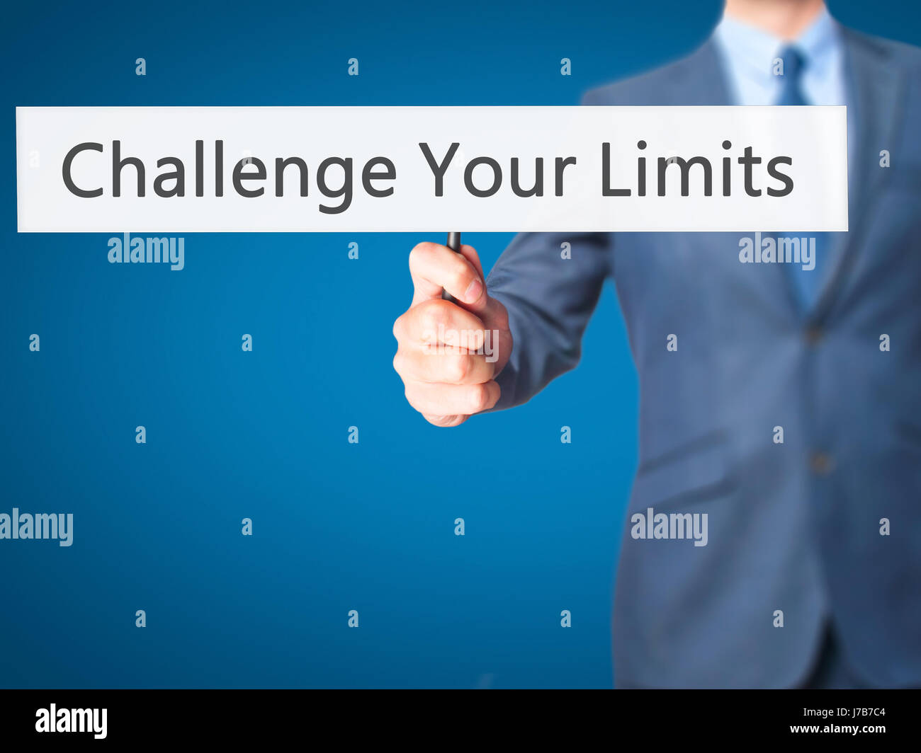 Challenge Your Limits - Business man showing sign. Business, technology ...
