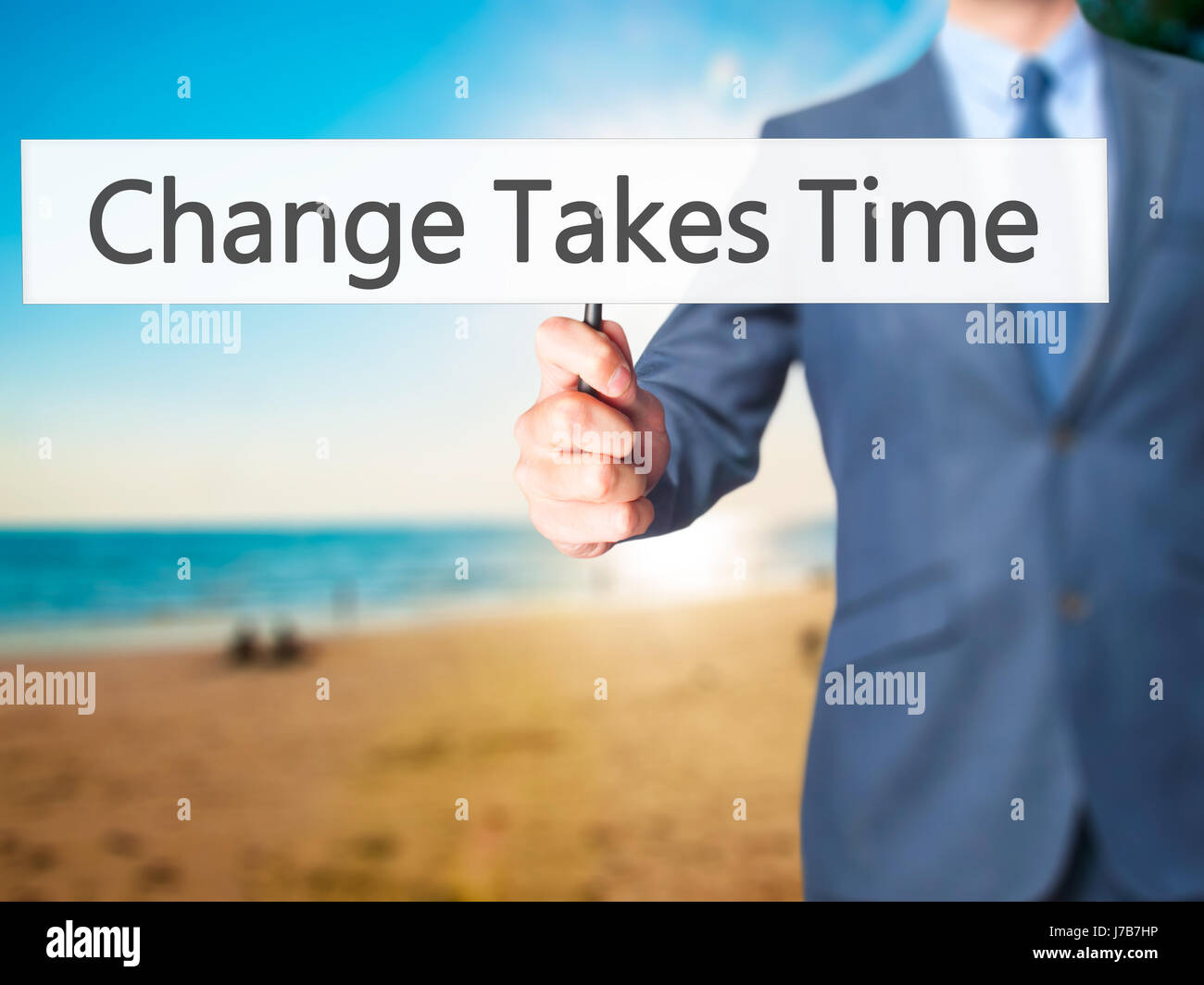 Change Takes Time - Businessman hand holding sign. Business, technology ...