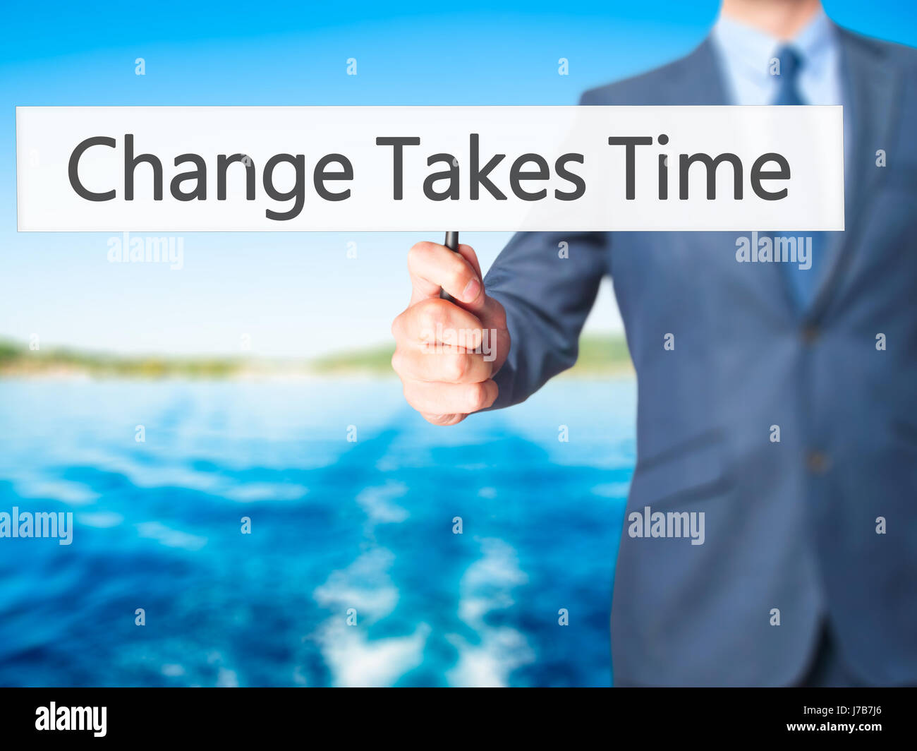 Change Takes Time - Businessman hand holding sign. Business, technology ...
