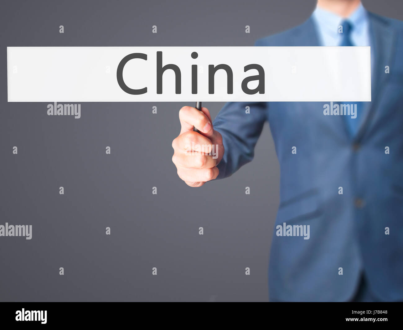 China - Businessman hand holding sign. Business, technology, internet ...