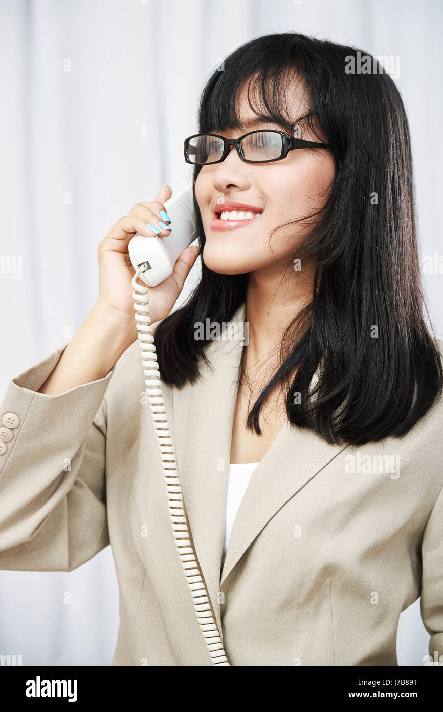 portrait of businesswoman calling someone by telephone Stock Photo - Alamy