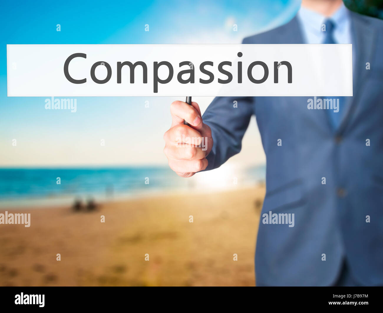 Compassion - Business man showing sign. Business, technology, internet ...