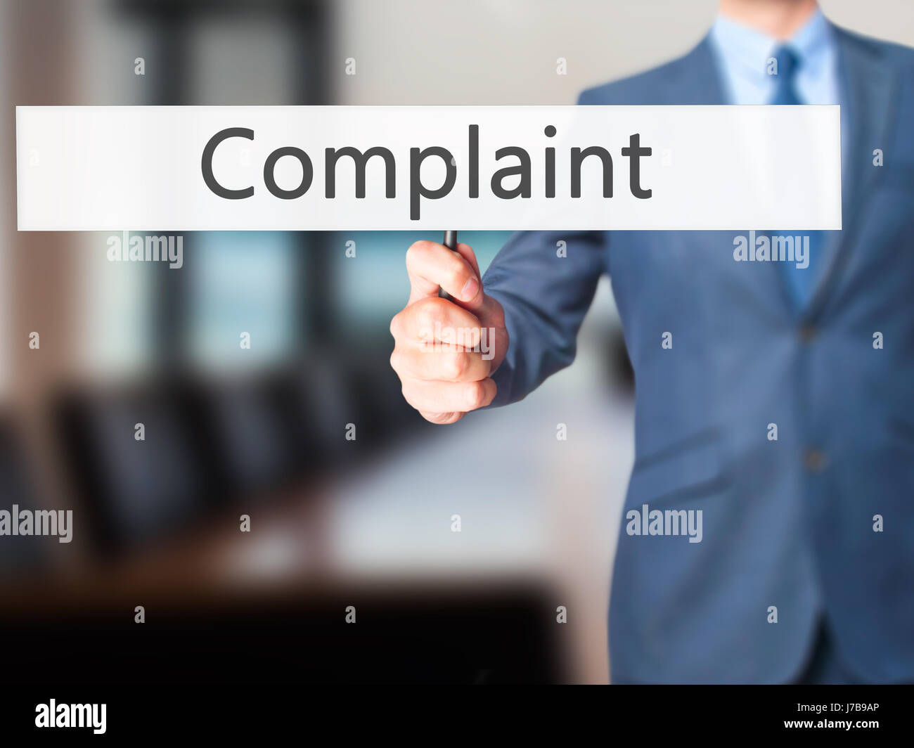 Complaint - Business man showing sign. Business, technology, internet ...