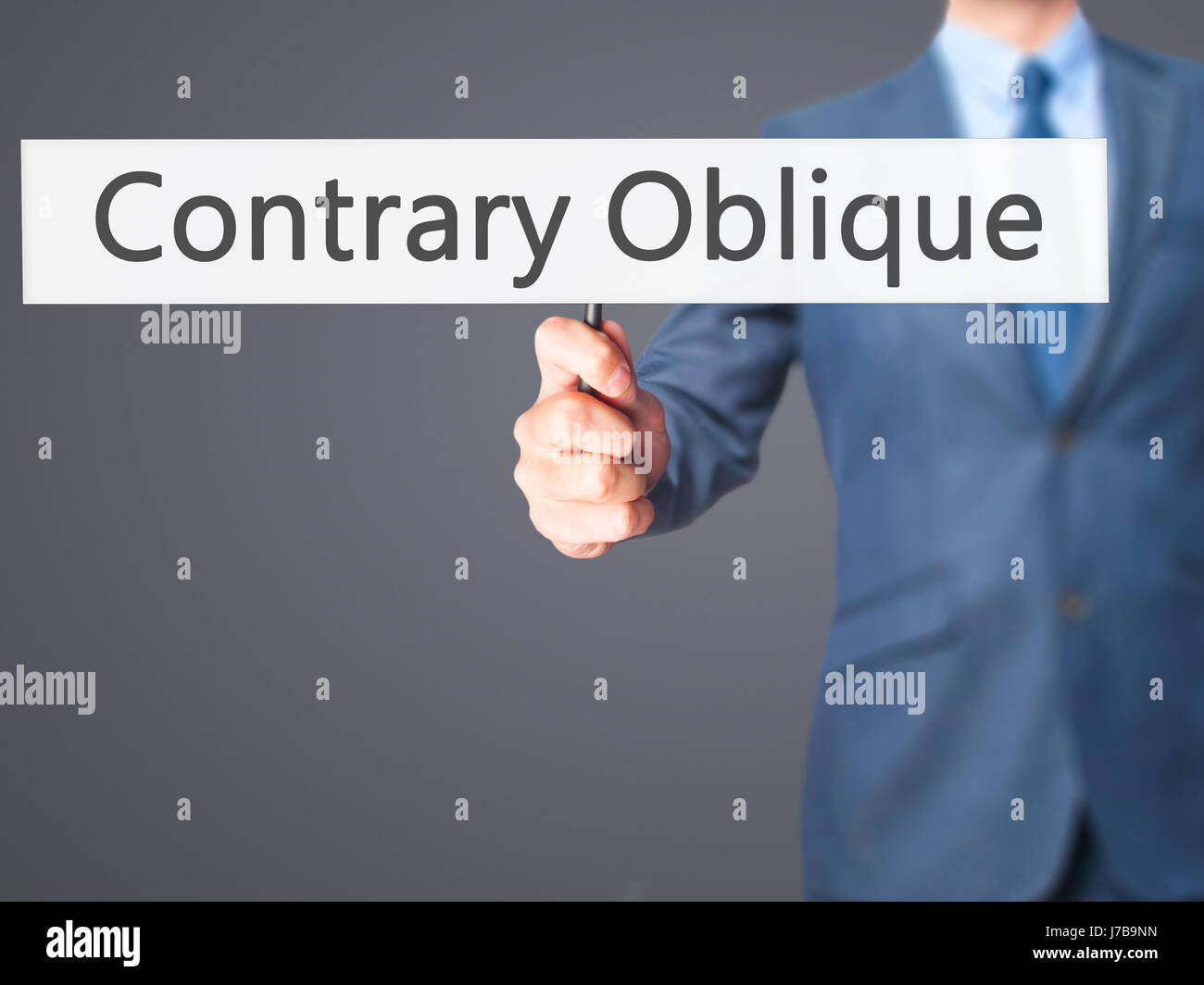Contrary - Oblique - Businessman hand holding sign. Business ...