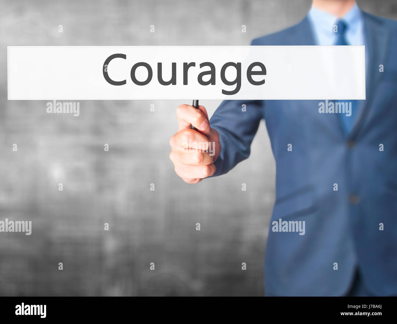 Courage - Business man showing sign. Business, technology, internet ...