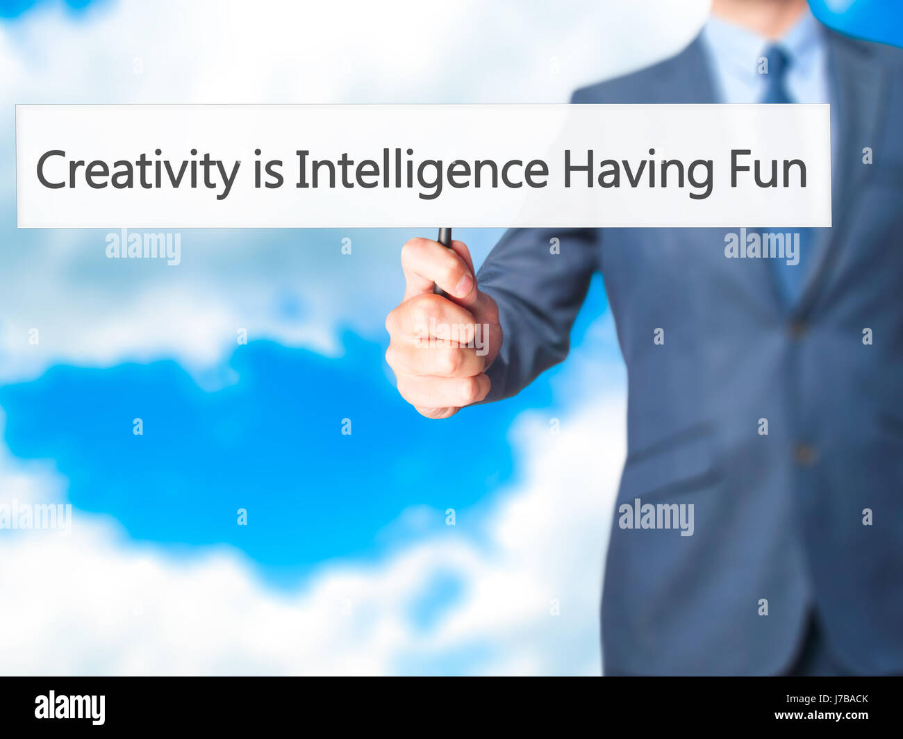 Creativity is Intelligence Having Fun - Business man showing sign. Business, technology ...