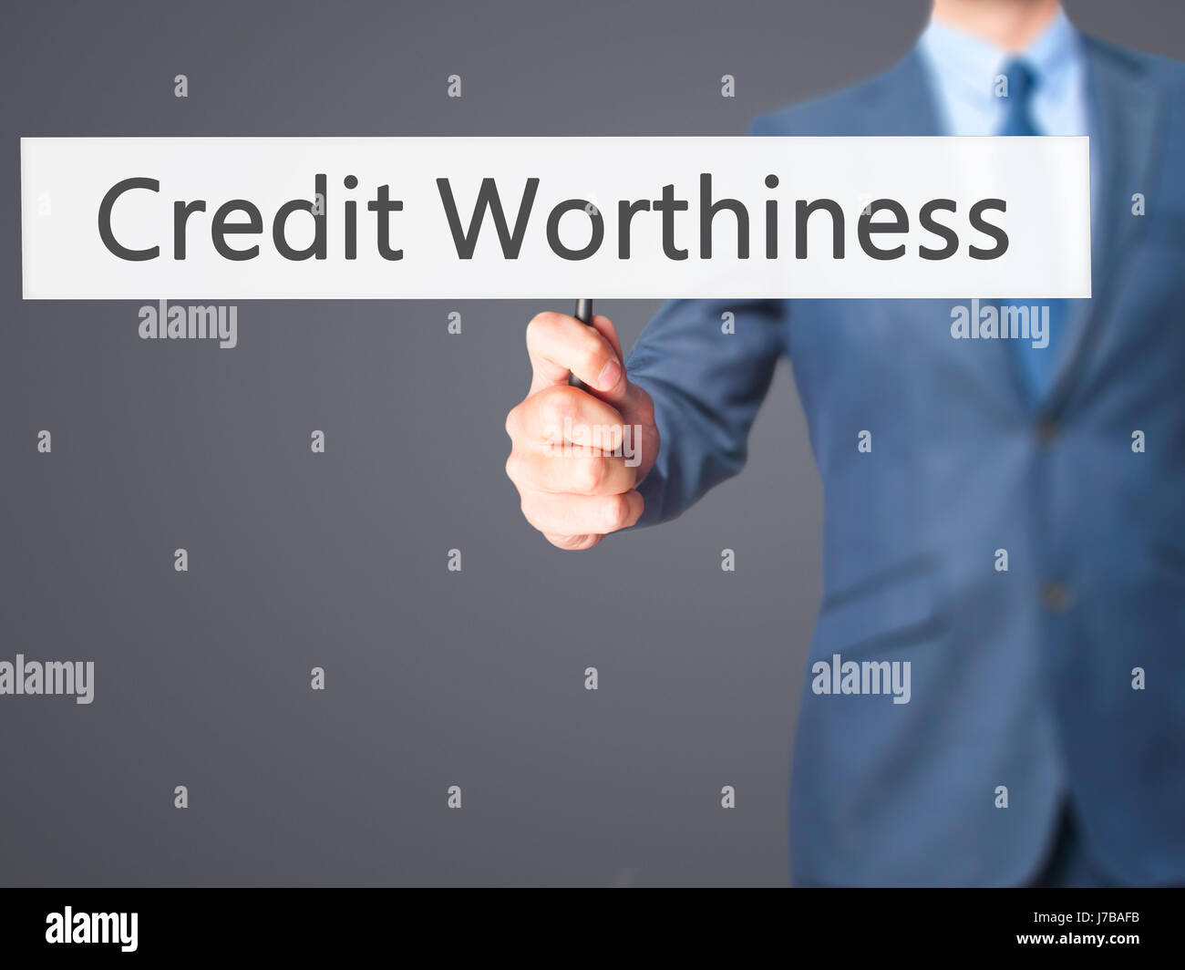 Credit Worthiness - Businessman hand holding sign. Business, technology ...