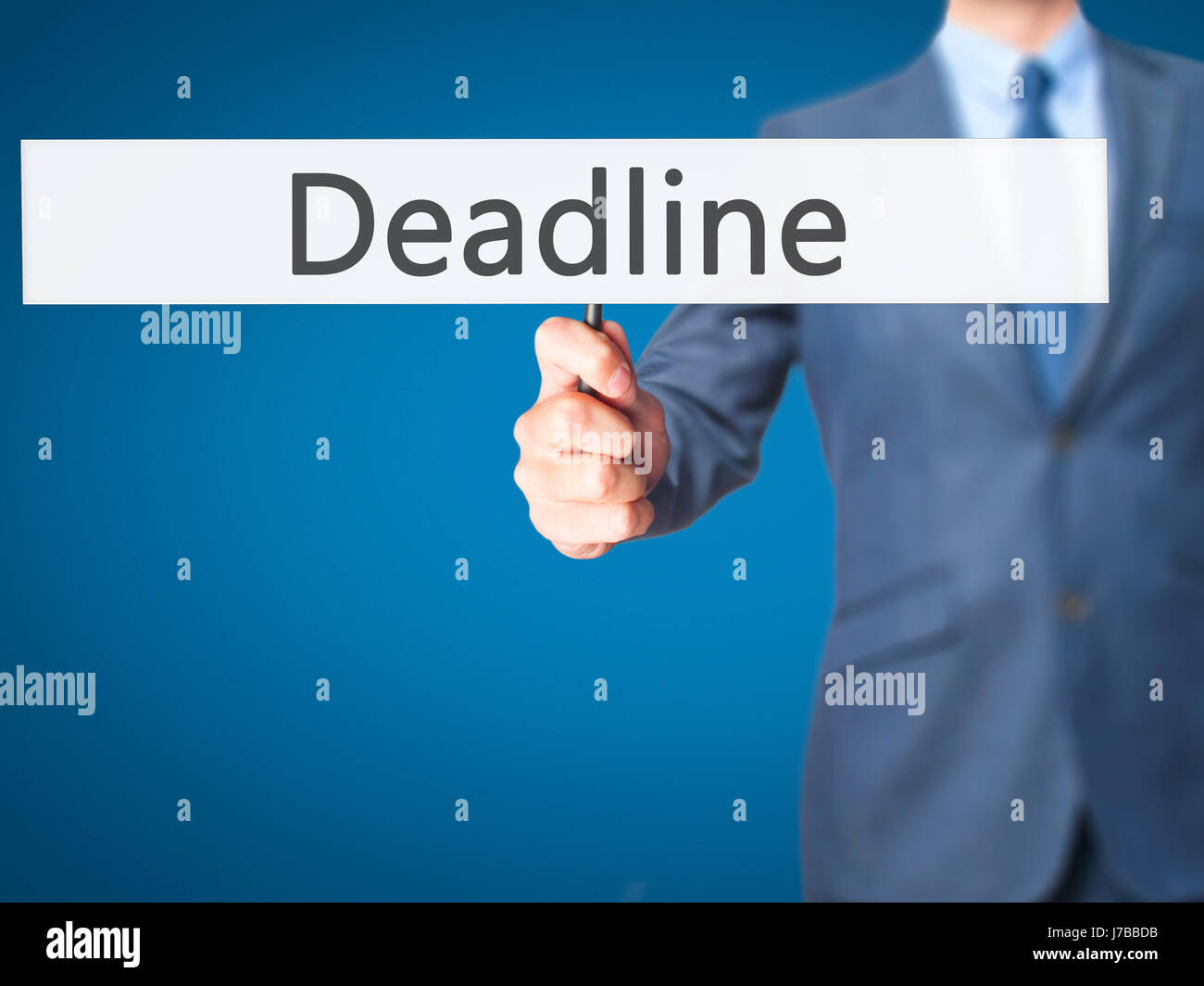 Deadline - Businessman hand holding sign. Business, technology ...