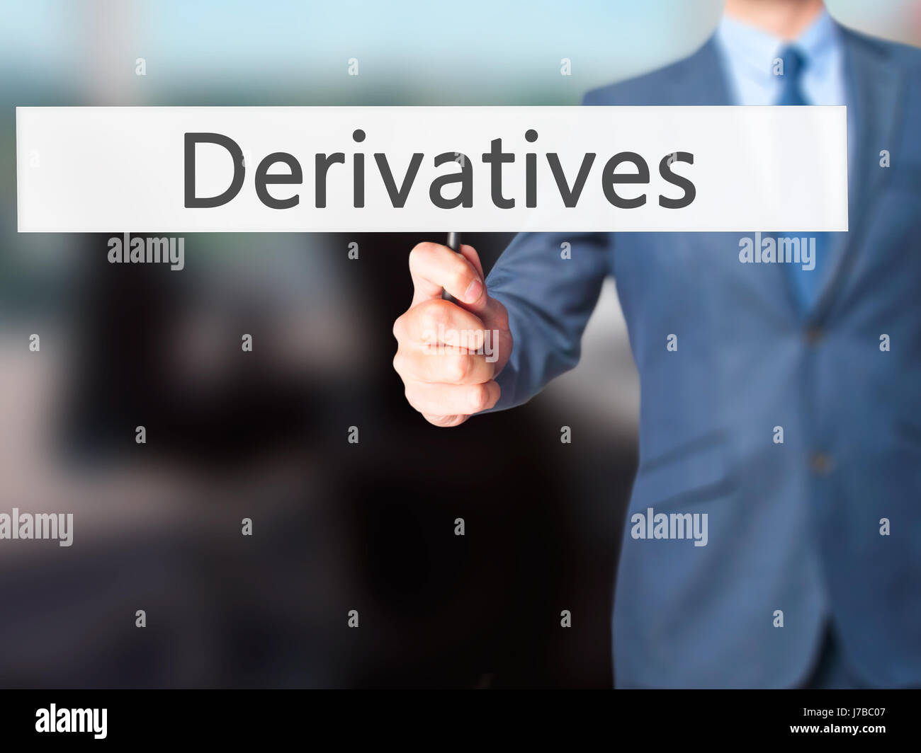 Derivatives - Businessman hand holding sign. Business, technology ...