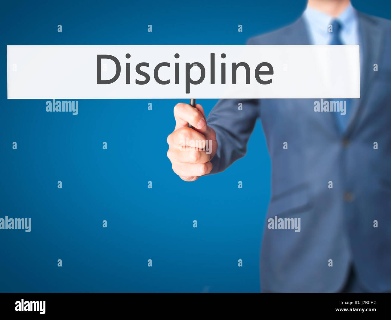 Discipline - Businessman hand holding sign. Business, technology ...