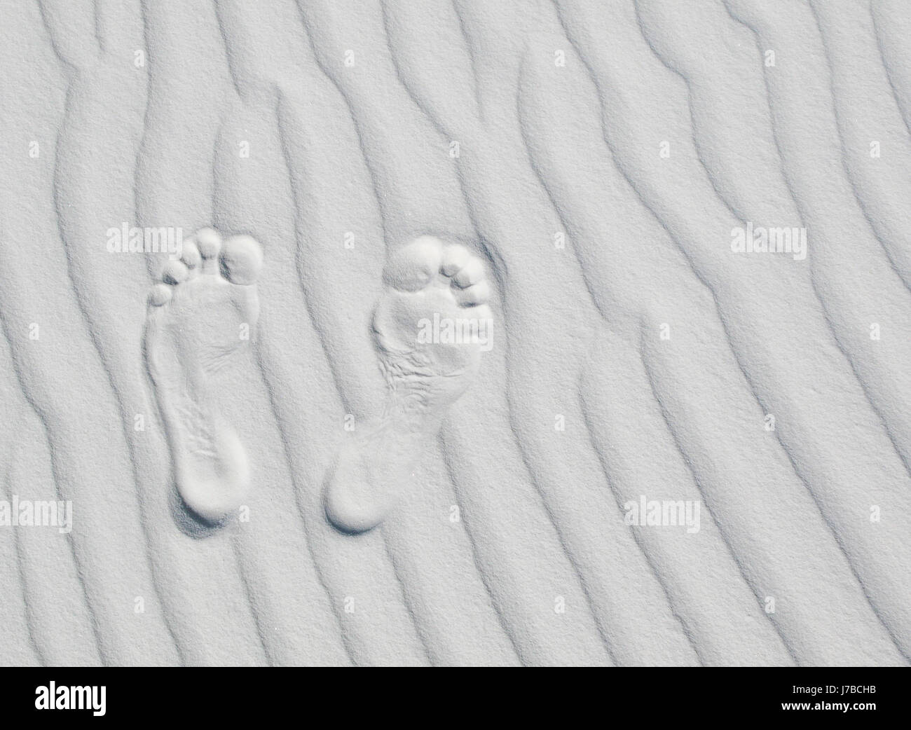 footprints on white Stock Photo - Alamy