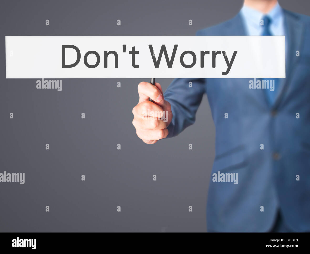 Don't Worry - Businessman hand holding sign. Business, technology ...