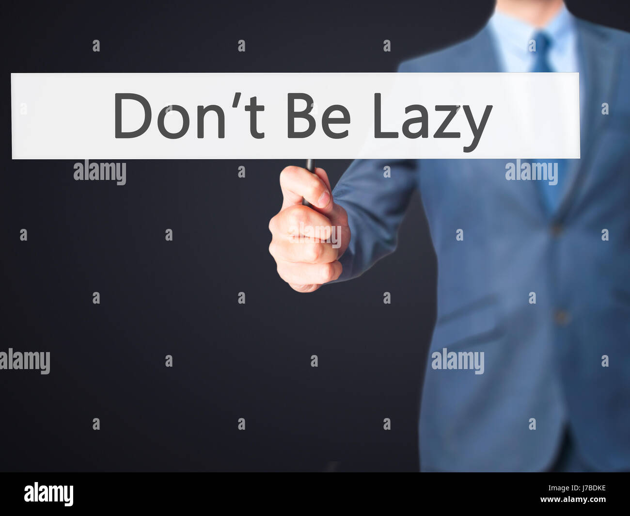 Don't Be Lazy - Businessman hand holding sign. Business, technology ...