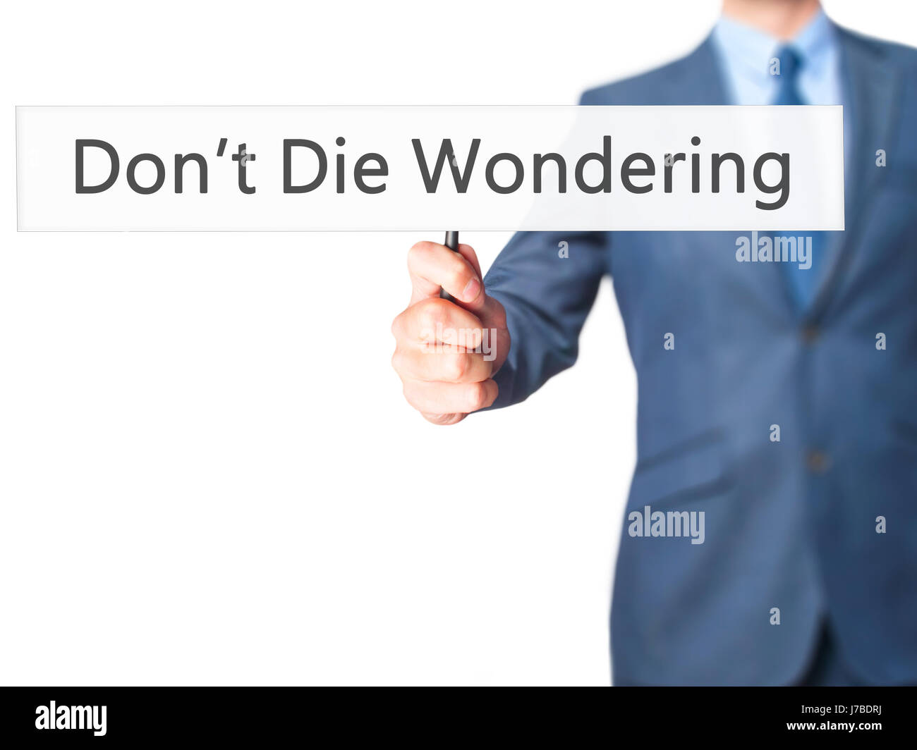 Don't Die Wondering - Businessman hand holding sign. Business ...