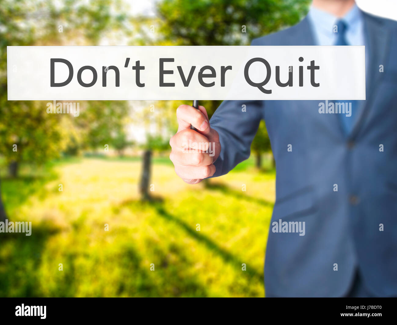Don't Ever Quit - Businessman hand holding sign. Business, technology ...