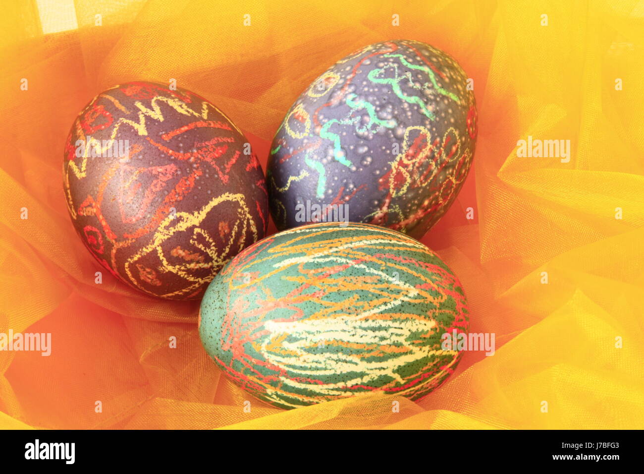 three colorful easter eggs Stock Photo - Alamy