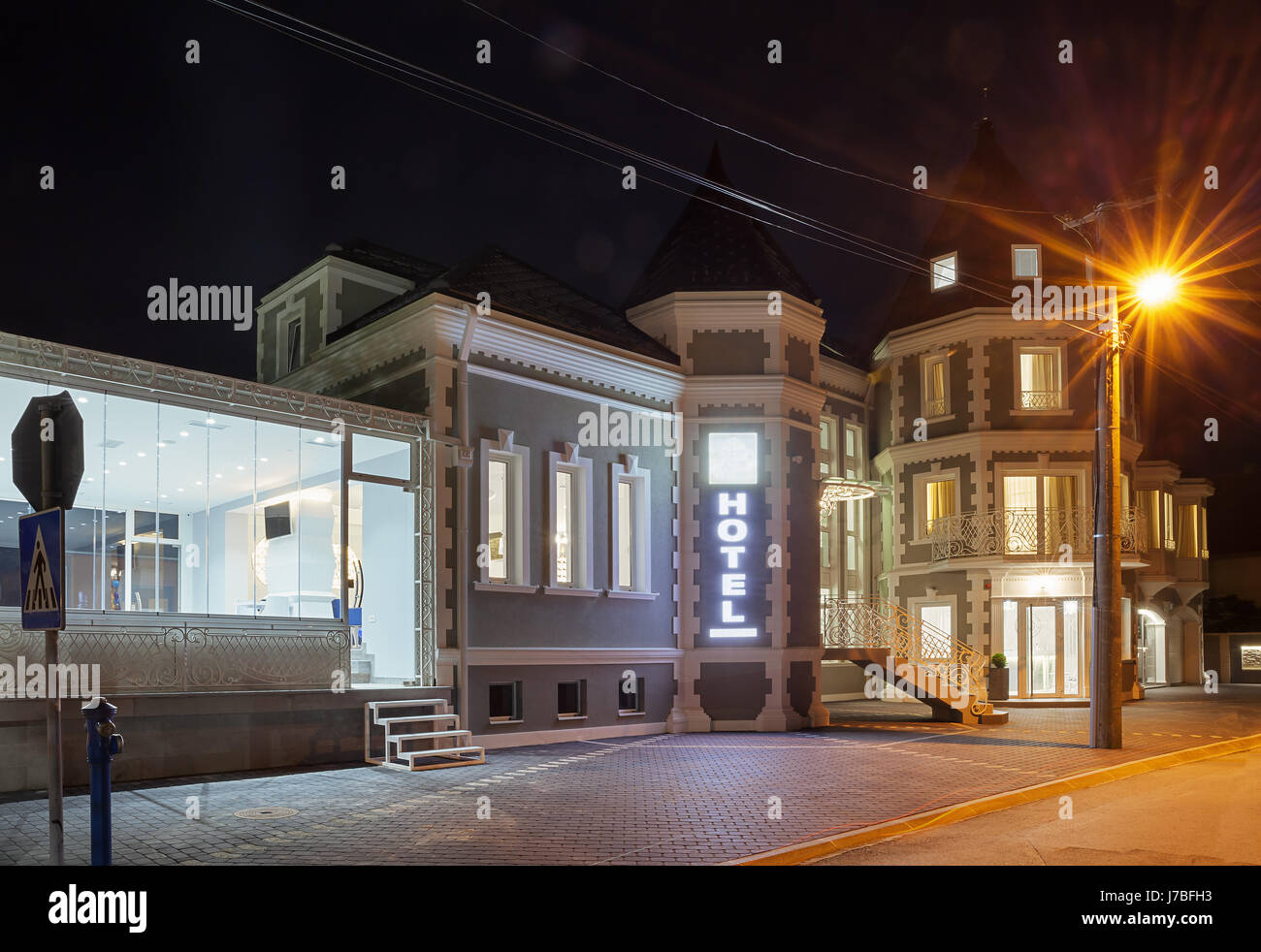 Exterior of a modern and new luxury hotel, night scene Stock Photo - Alamy