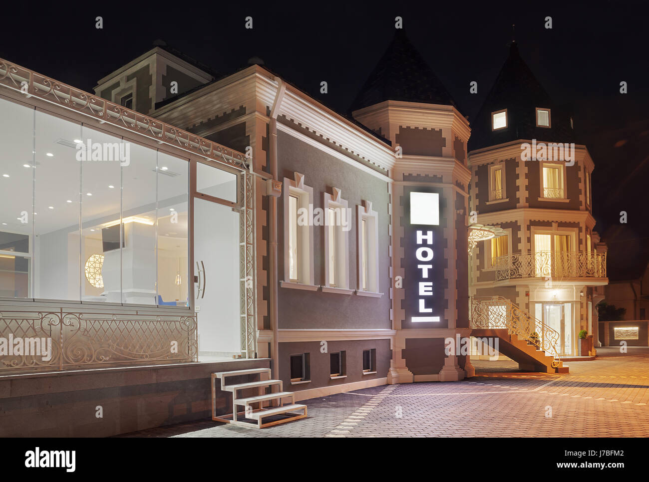 Exterior of a modern and new luxury hotel, night scene Stock Photo - Alamy