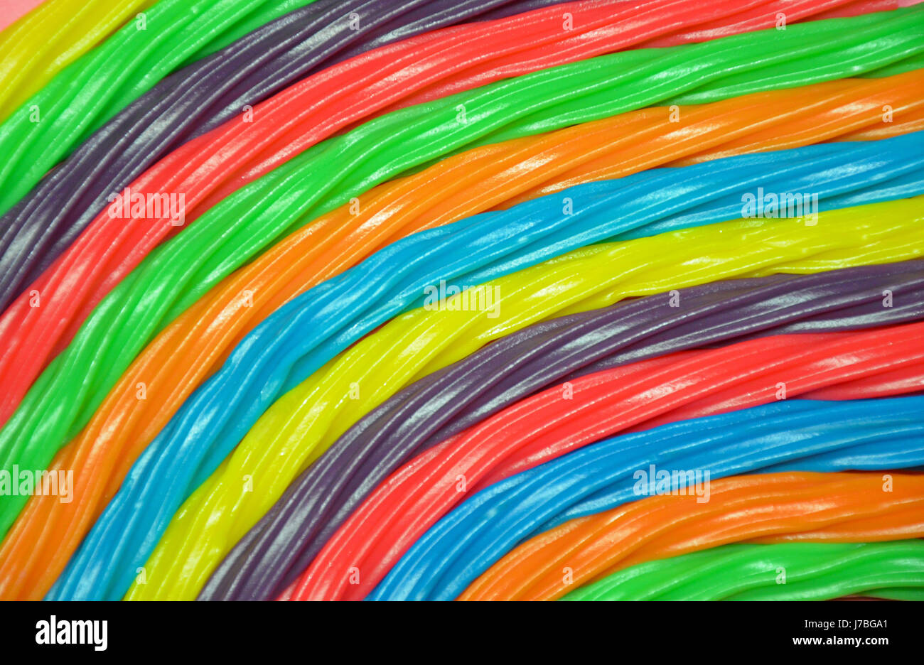 Colorful strands of rainbow licorice Stock Photo - Alamy