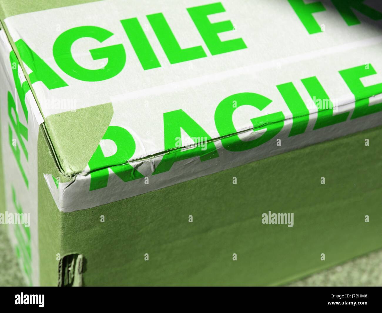 corrugated parcel box boxes fragile packet shipping sheet of paper paper Stock Photo - Alamy