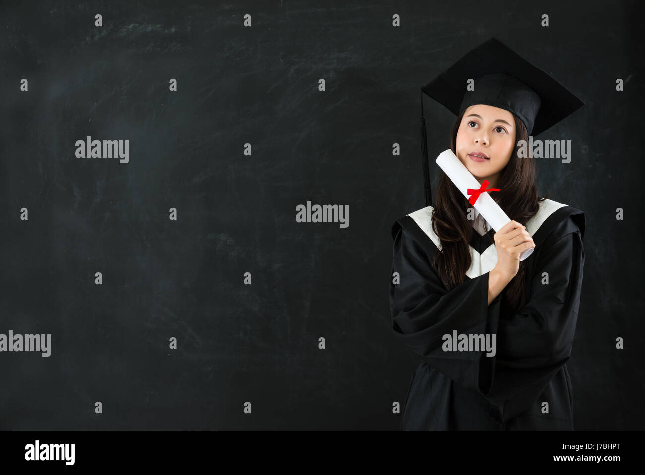asian chinese university female student graduate getting diploma think ...