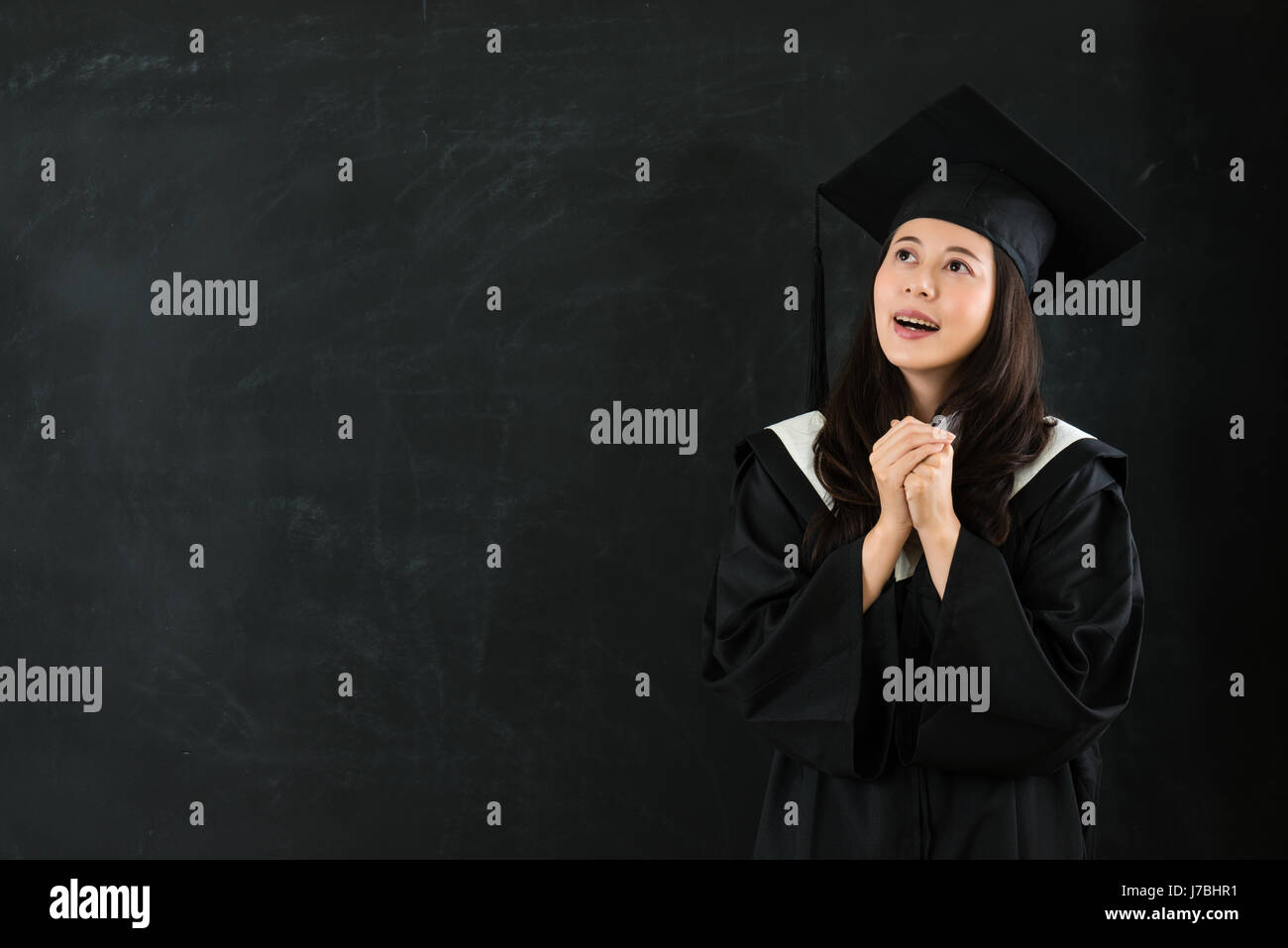 gentle brunette bachelor degree girl full of longing about future, hold ...