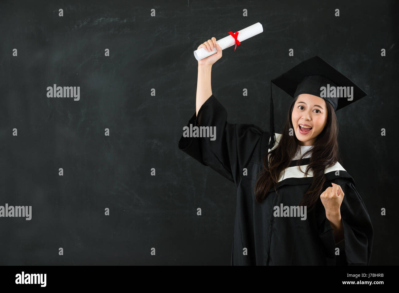happy gesture asian woman holding graduation scroll on black empty ...