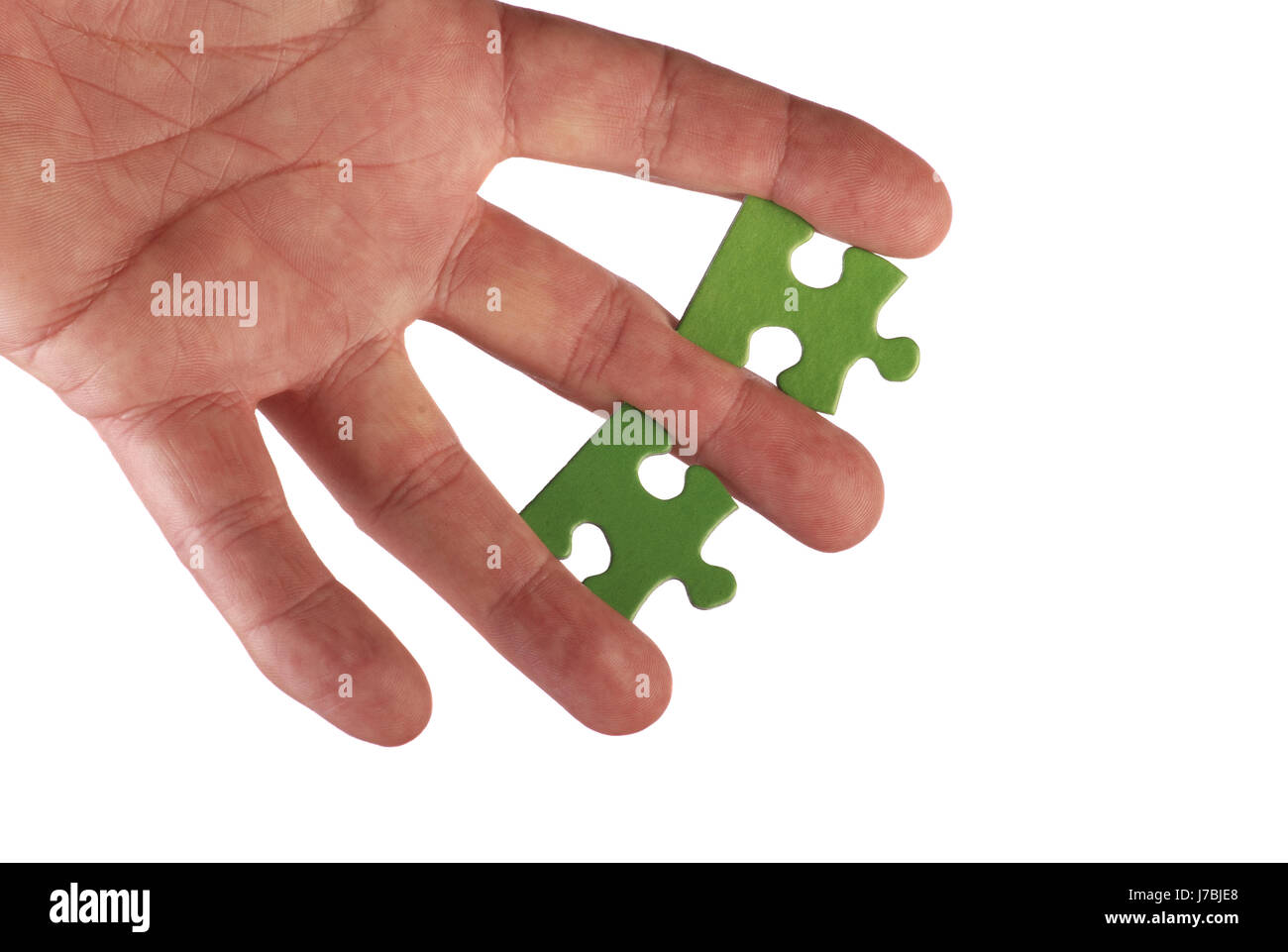 hand with puzzle pieces Stock Photo - Alamy