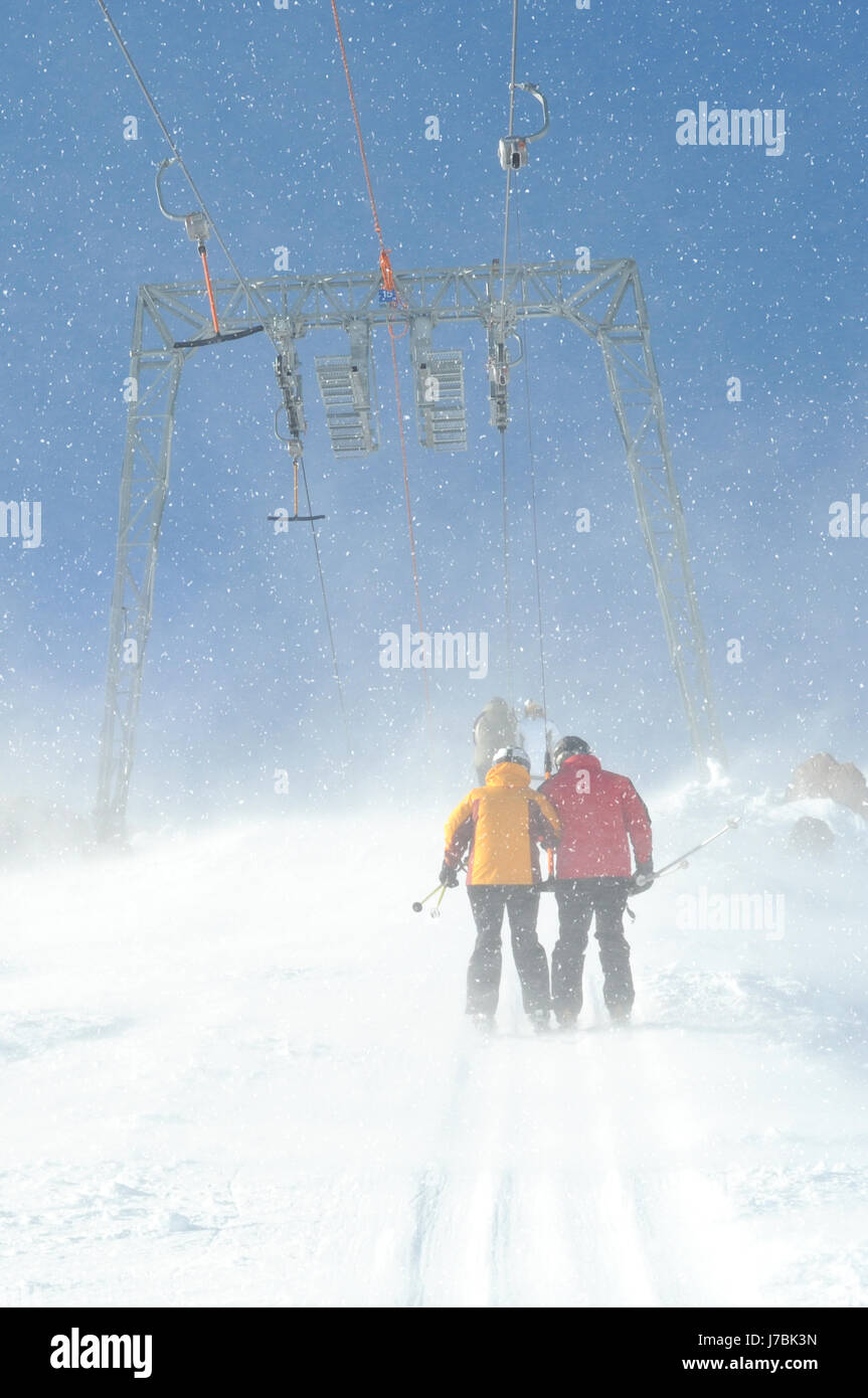 winter snowy snowfall ski skiing blizzard couple pair blue humans human ...