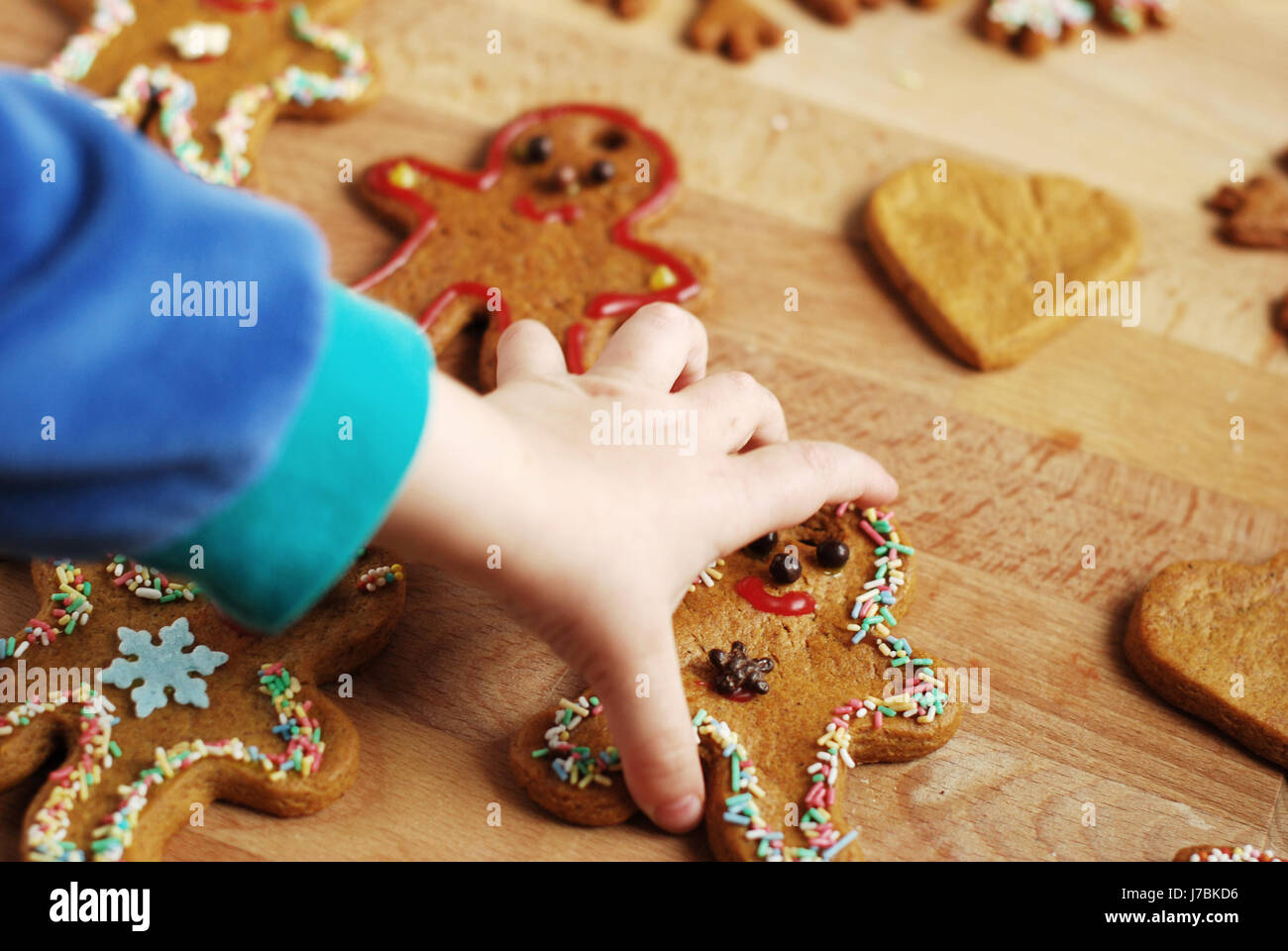 Child reaching for biscuit hi-res stock photography and images - Alamy