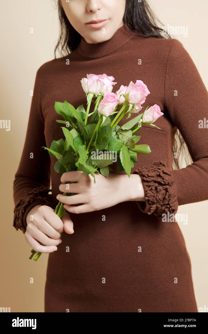 Seventies Woman Holding Roses Stock Photo - Alamy