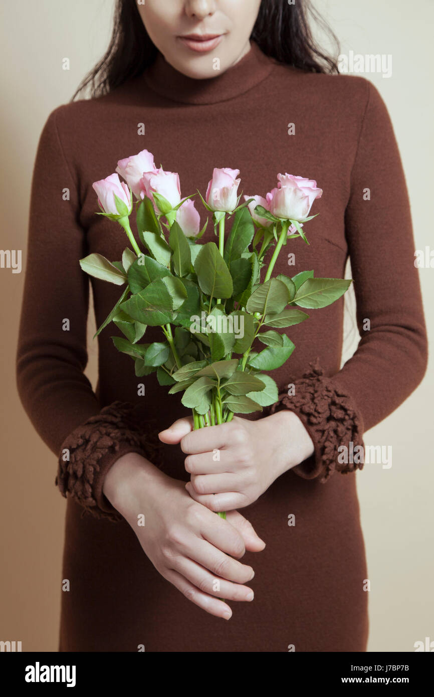 Seventies Woman Holding Roses Stock Photo - Alamy
