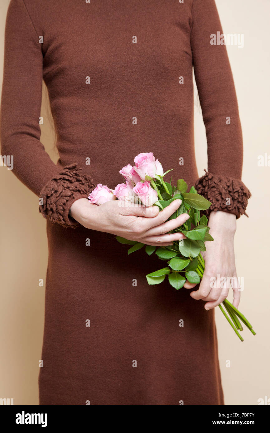Seventies Woman Holding Roses Stock Photo - Alamy