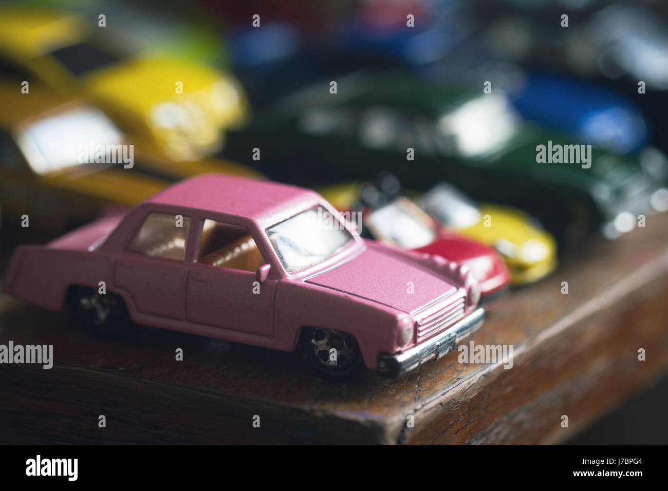 front view assorted metal colorful toy car collection sitting on the ...