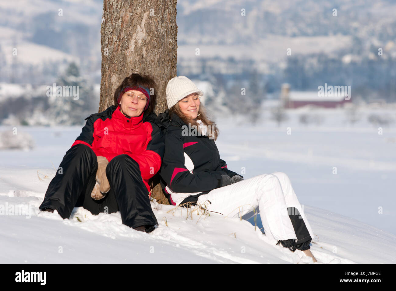 woman tree winter snow girl girls woman wait waiting laugh laughs ...